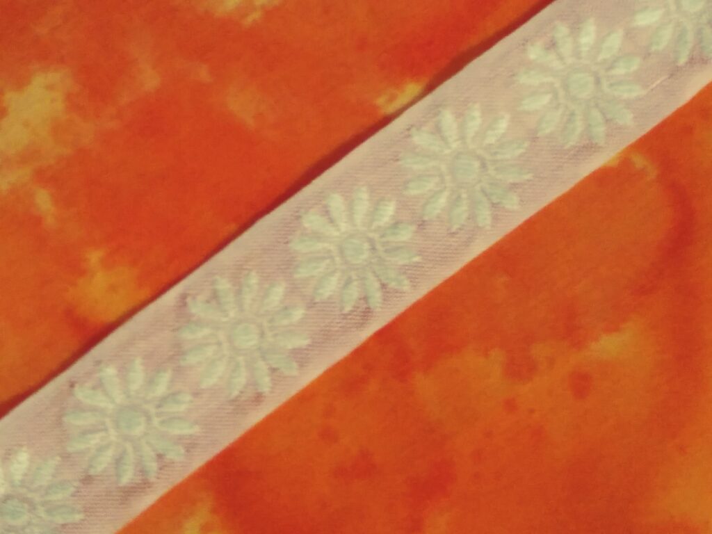 JAQ-70740-577 – 7/8″ White Embossed Flower Trim on Pink – Limited ...